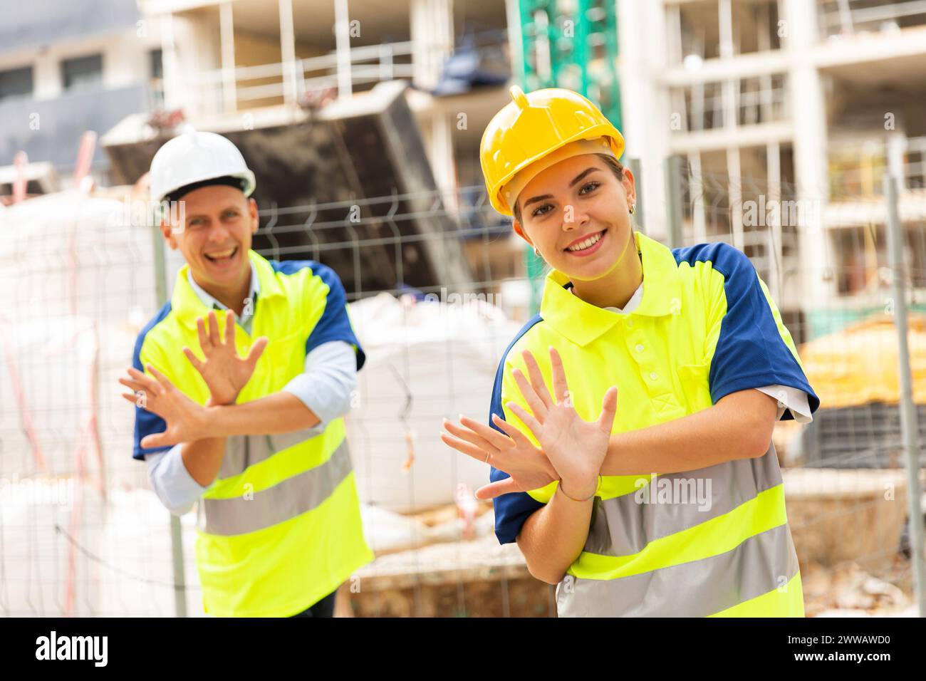Builders dancing in construction site Stock Photo - Alamy