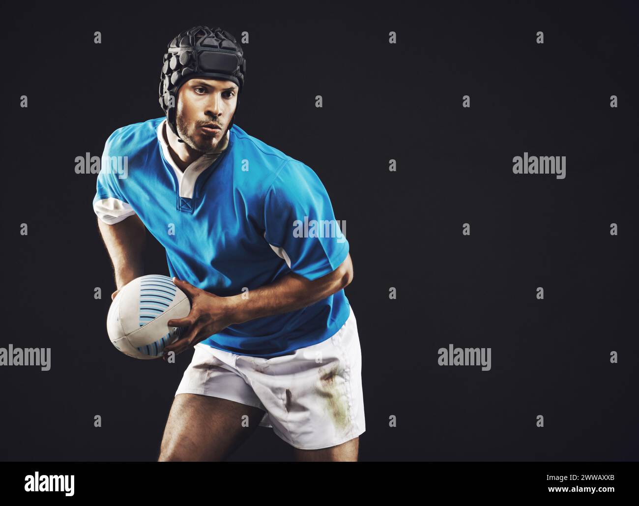 Black background, rugby and man in action with ball for training ...