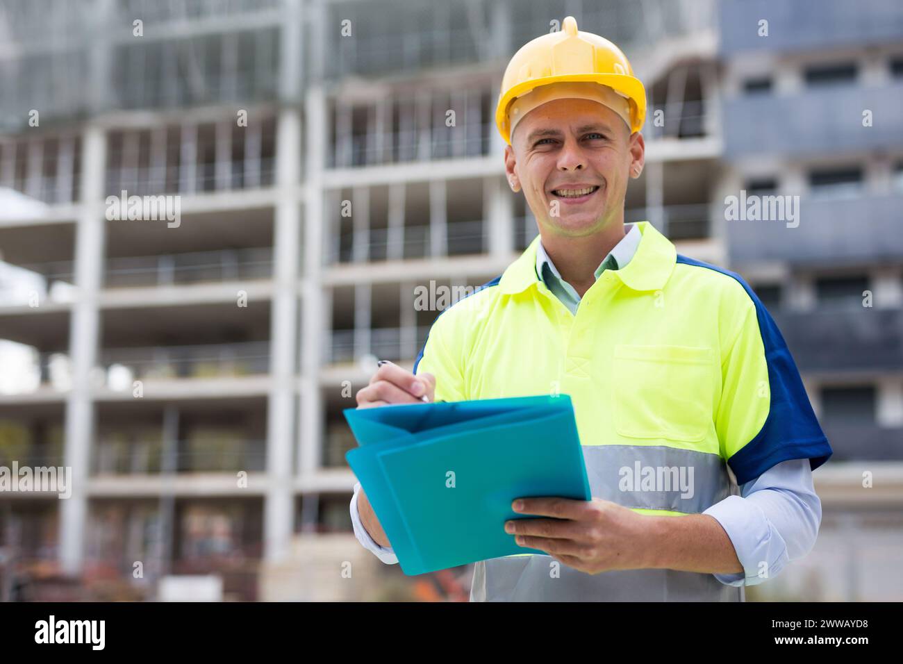 Young civil engineer makes important work notes Stock Photo - Alamy