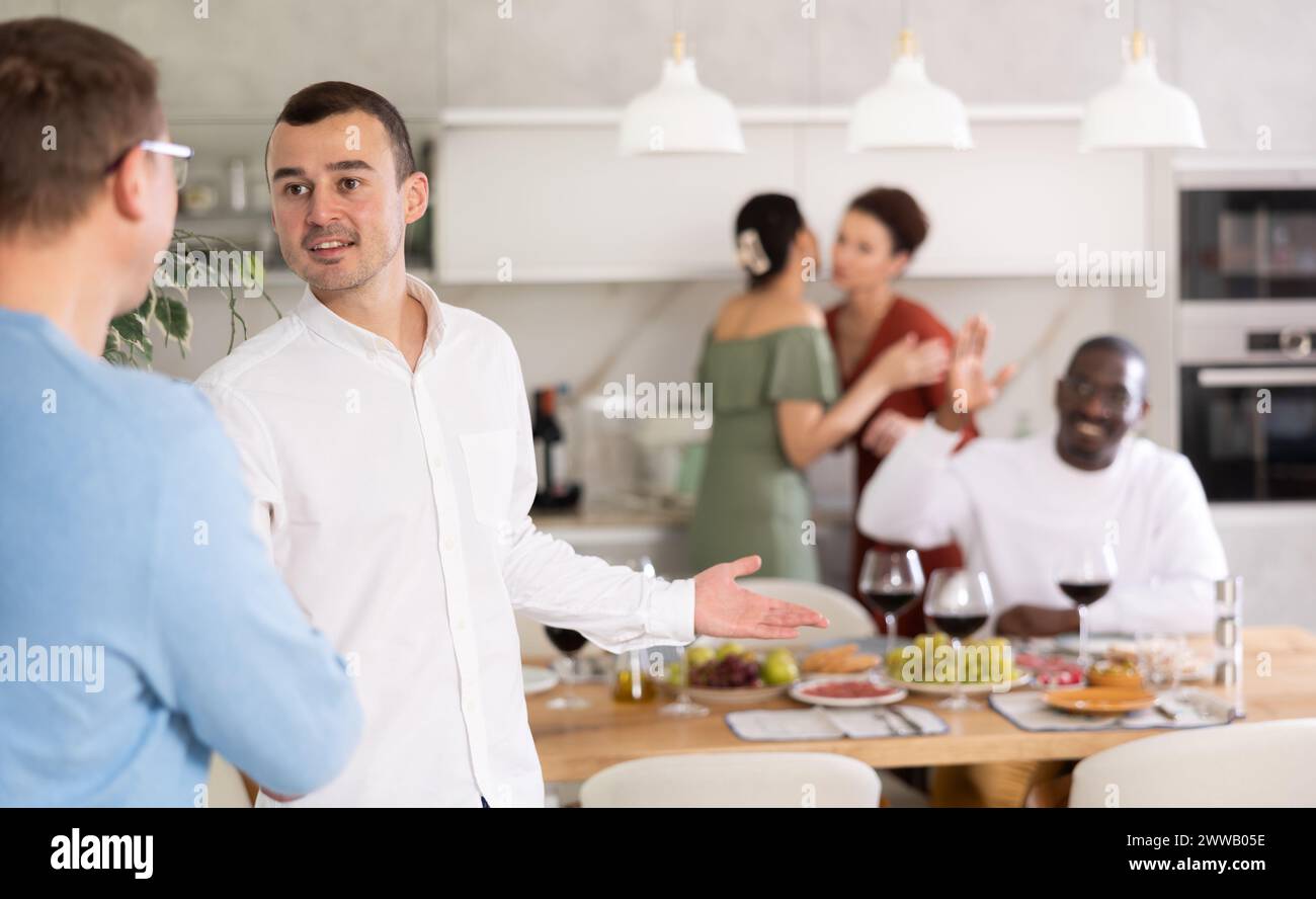 Male welcoming friend home hi-res stock photography and images - Alamy