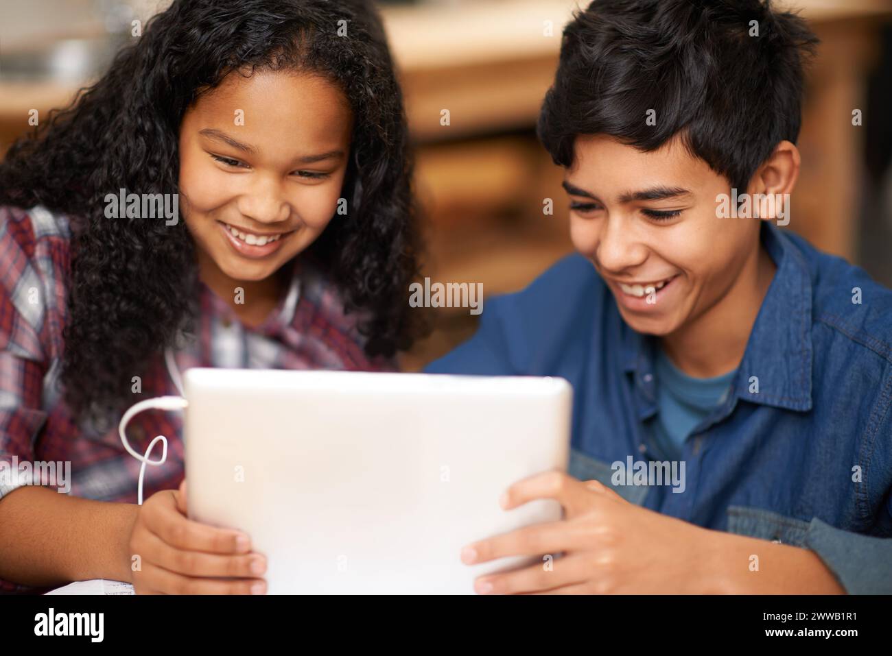 Students, boy and girl with tablet in classroom for elearning ...