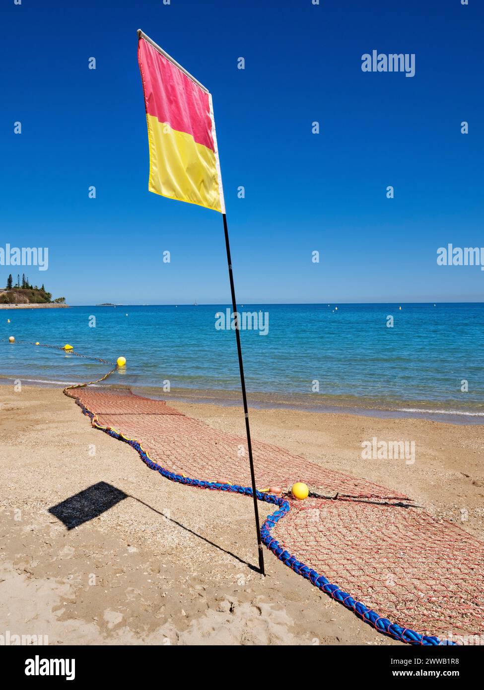 South Pacific Cruise / A red and yellow safety flag and shark net in ...