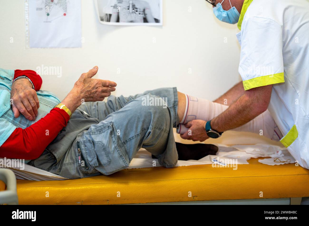 Care of a patient's foot ulcer. Wound cleaning and dressings Stock ...