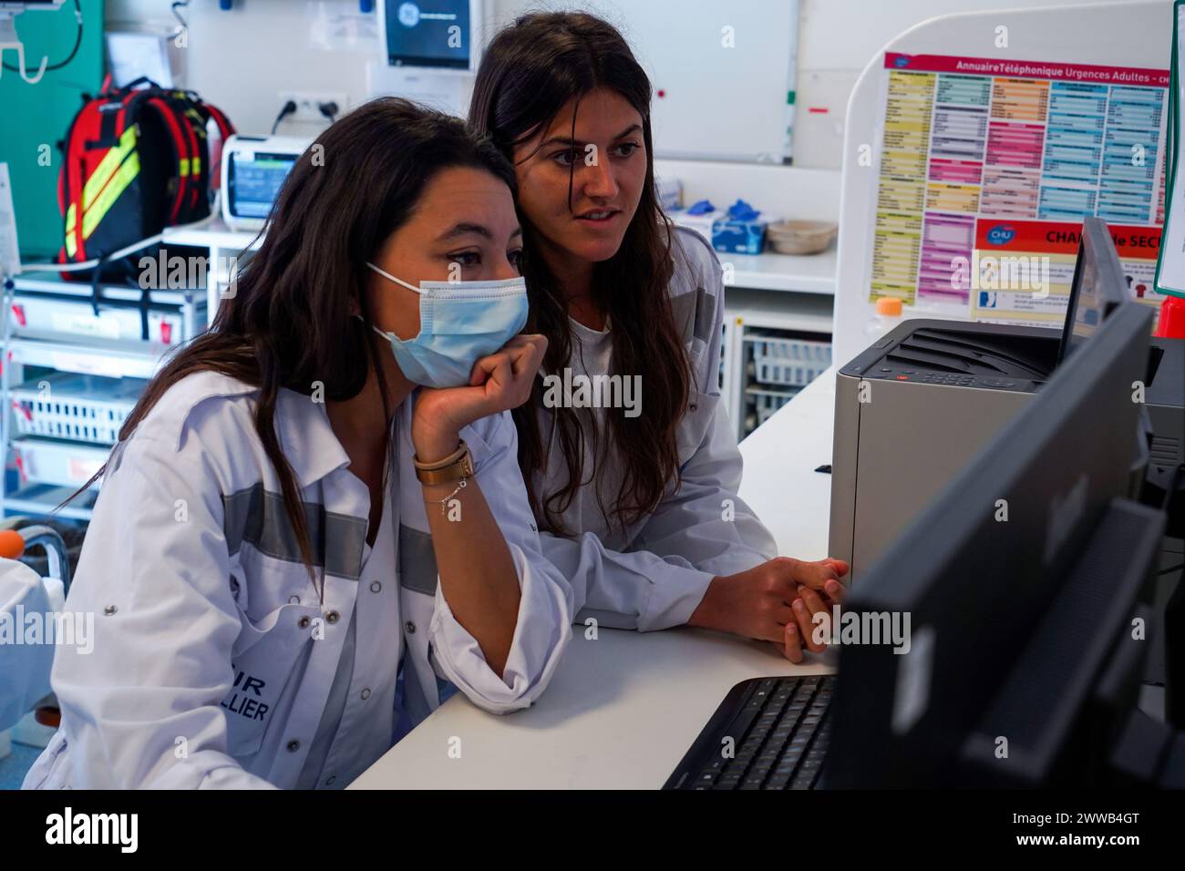 Two doctors in the shock room in the intensive care unit of a ...