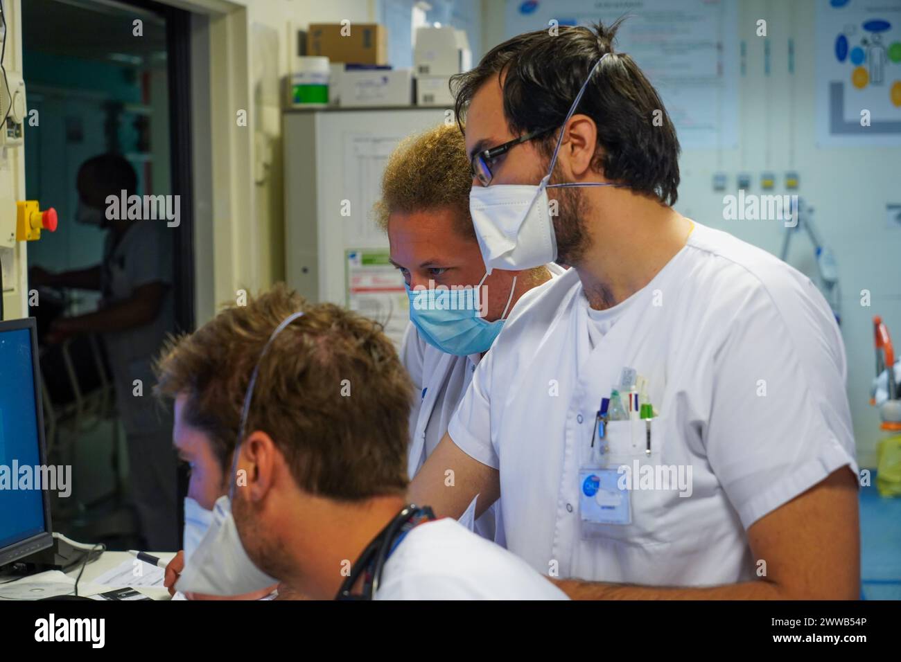 Hospital staff in the shock ward in the intensive care unit of a ...