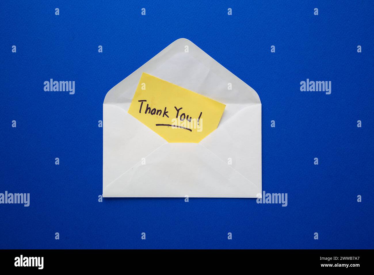 Thank you note on yellow paper in an envelope. Thank you message Stock ...