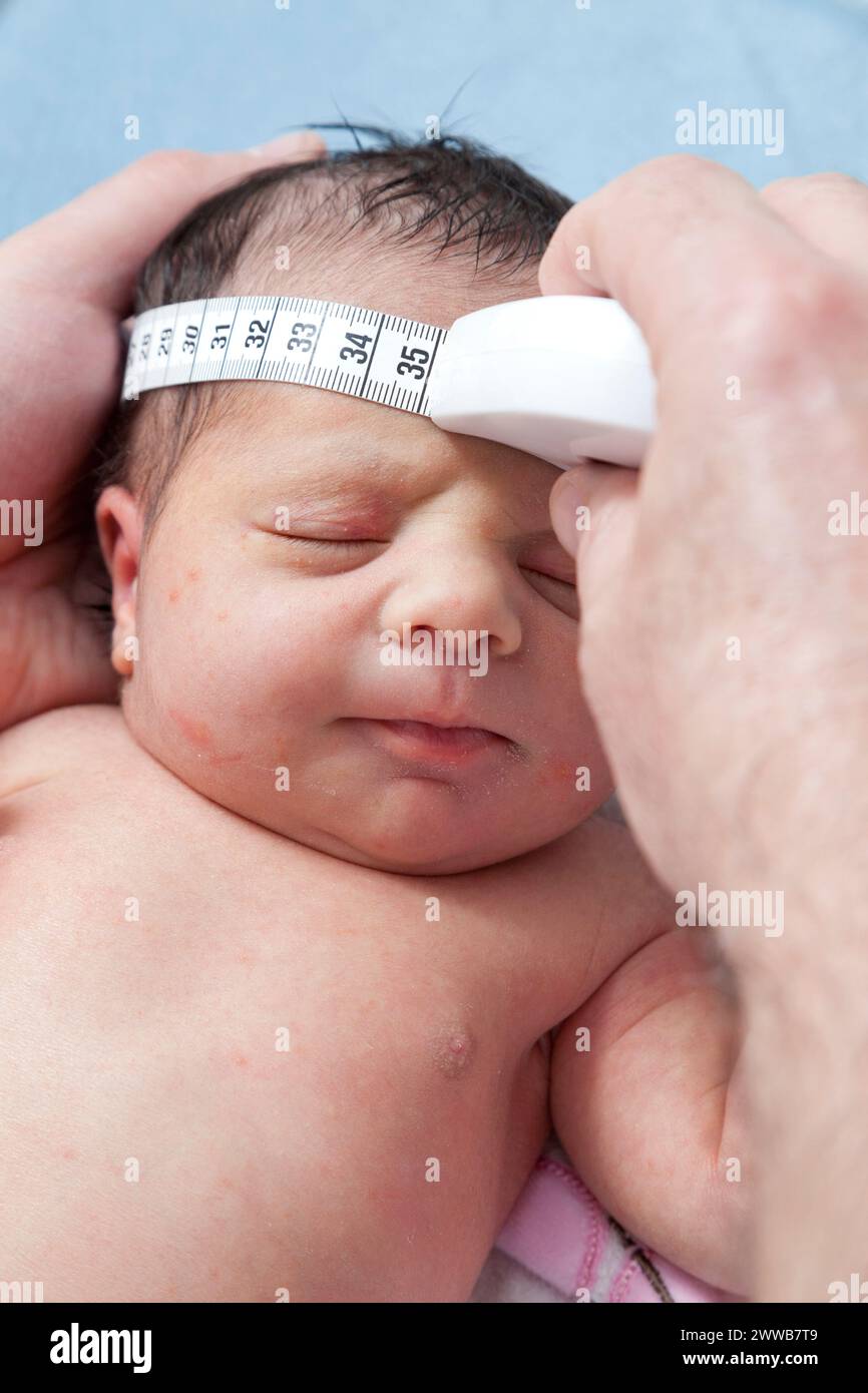 The pediatrician measures the head circumference Stock Photo - Alamy