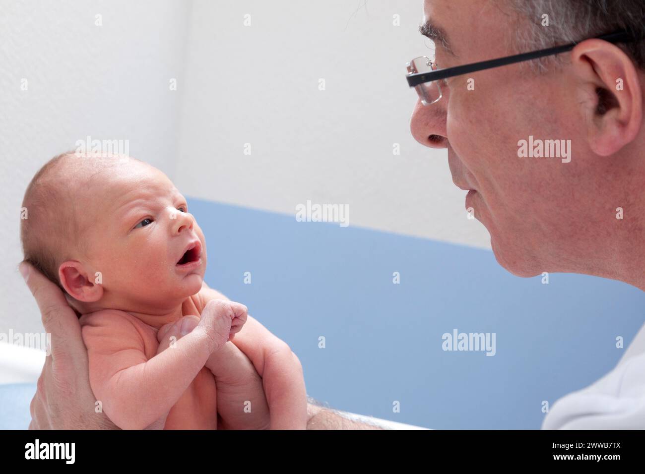 The pediatrician checks the condition of the eyes and the tracking of ...