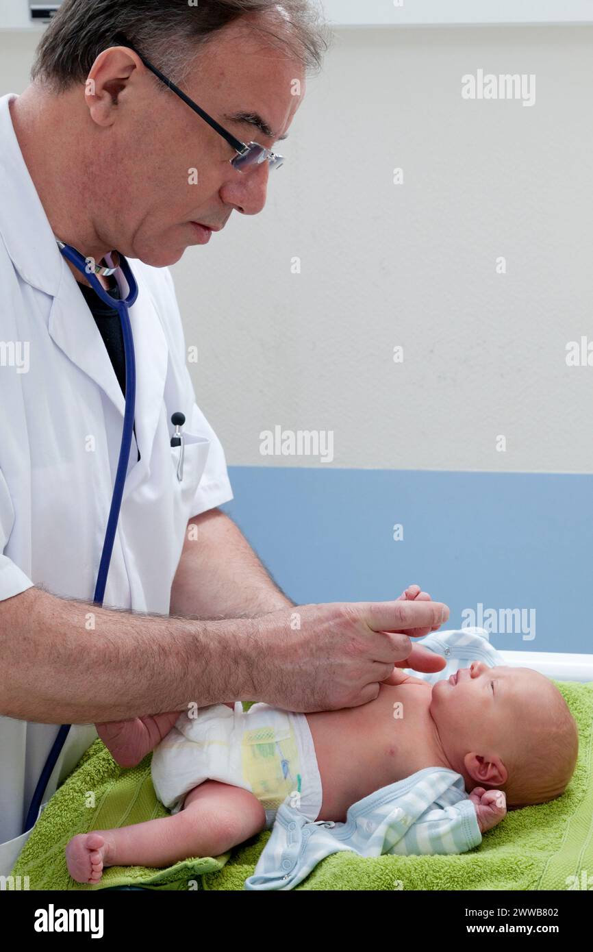 The pediatrician checks the general condition and tone of the newborn ...