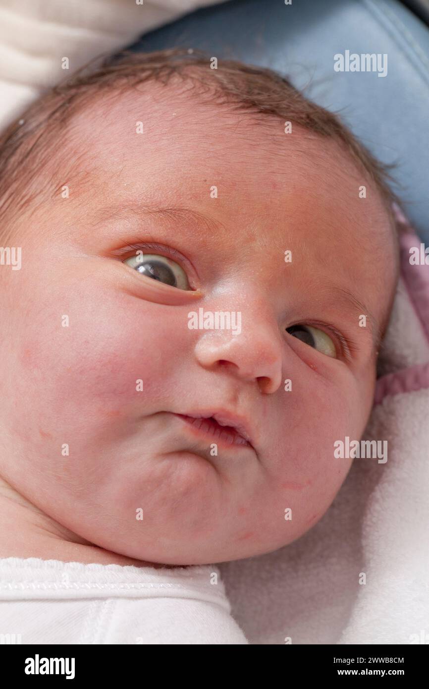 Baby squinting hi-res stock photography and images - Alamy