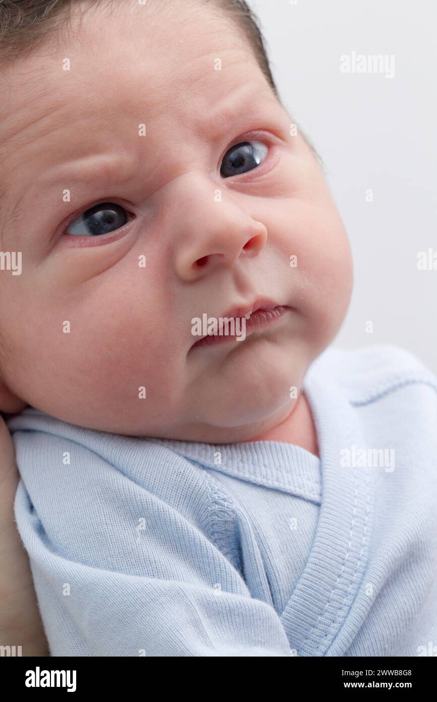 Baby squinting hi-res stock photography and images - Alamy