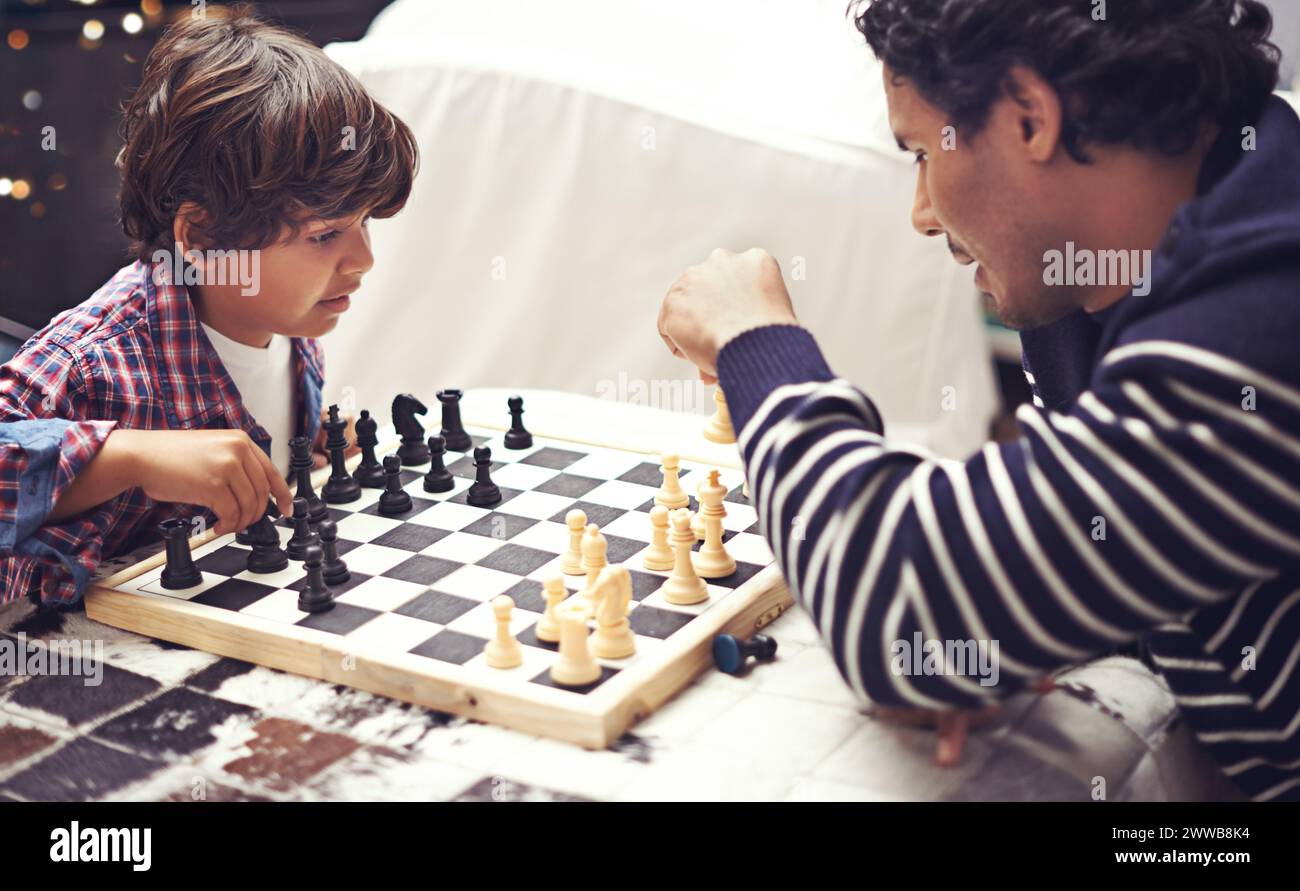 Father, child and chess board game for competition challenge for ...