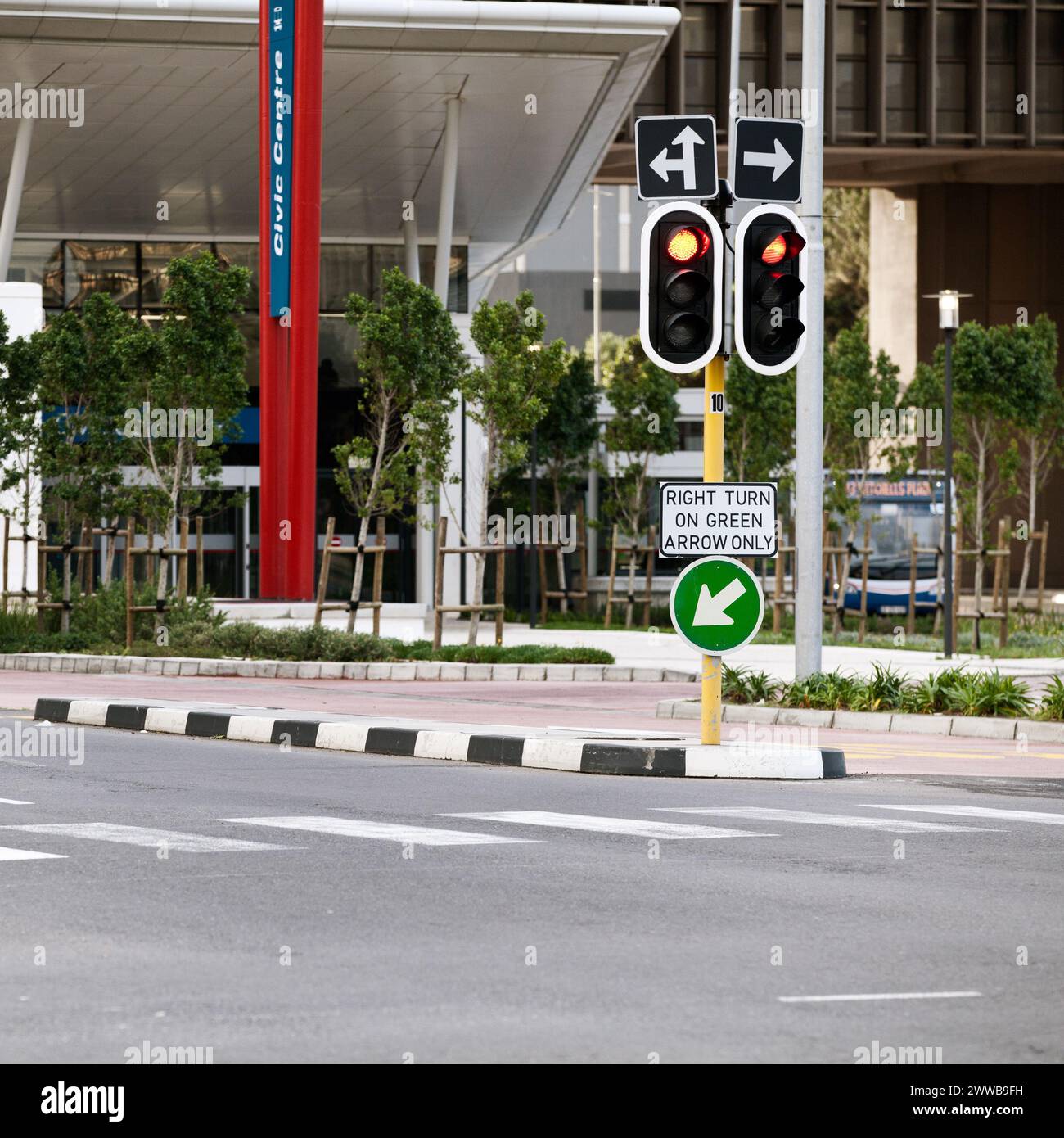 Road sign, traffic light and city with arrow for direction with travel ...