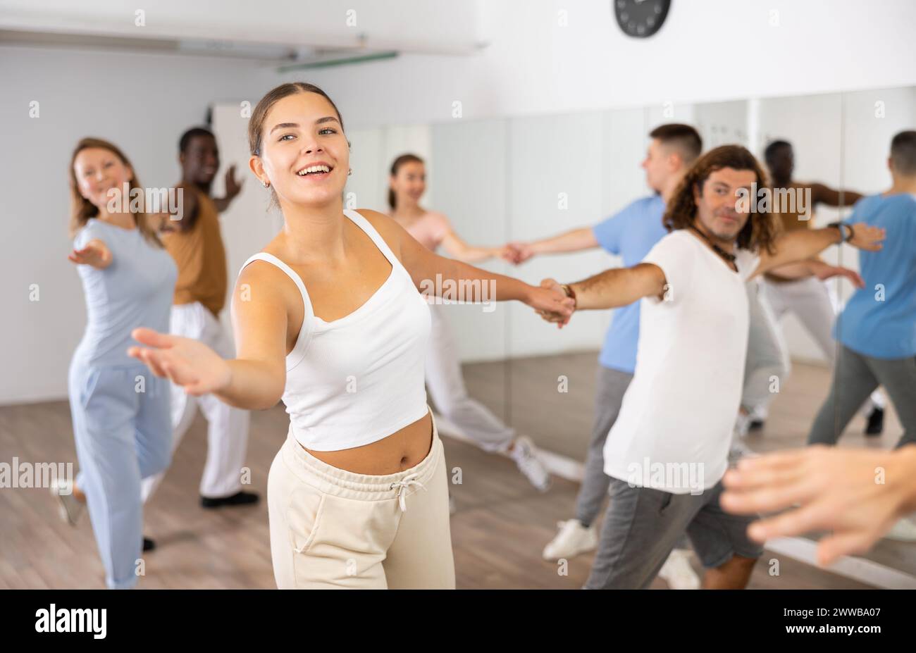 Adult couples dancing active dance together in studio Stock Photo - Alamy