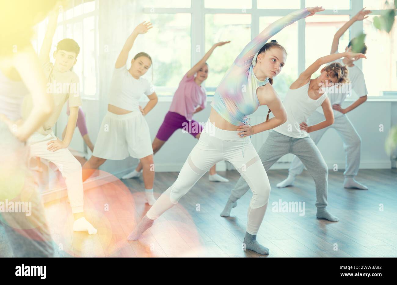 Group of children warming up before dance class Stock Photo - Alamy