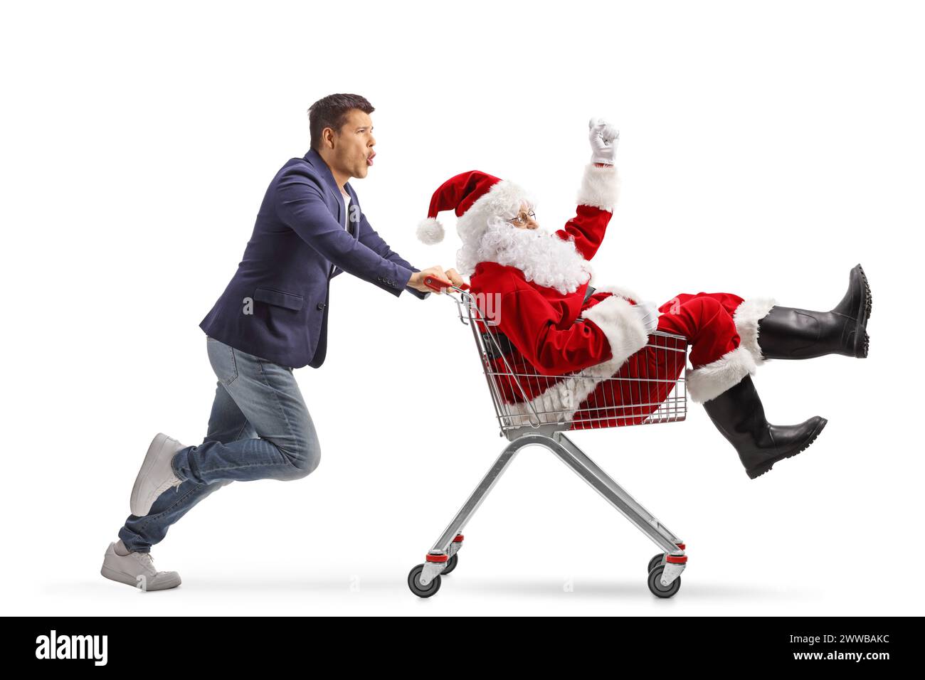 Young man pushing Santa Claus inside a shopping cart isolated on white ...