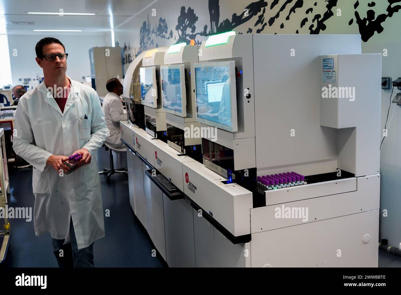 Technical platform of the Inovie 34 laboratory . Laboratory technician working on the Beckman ...