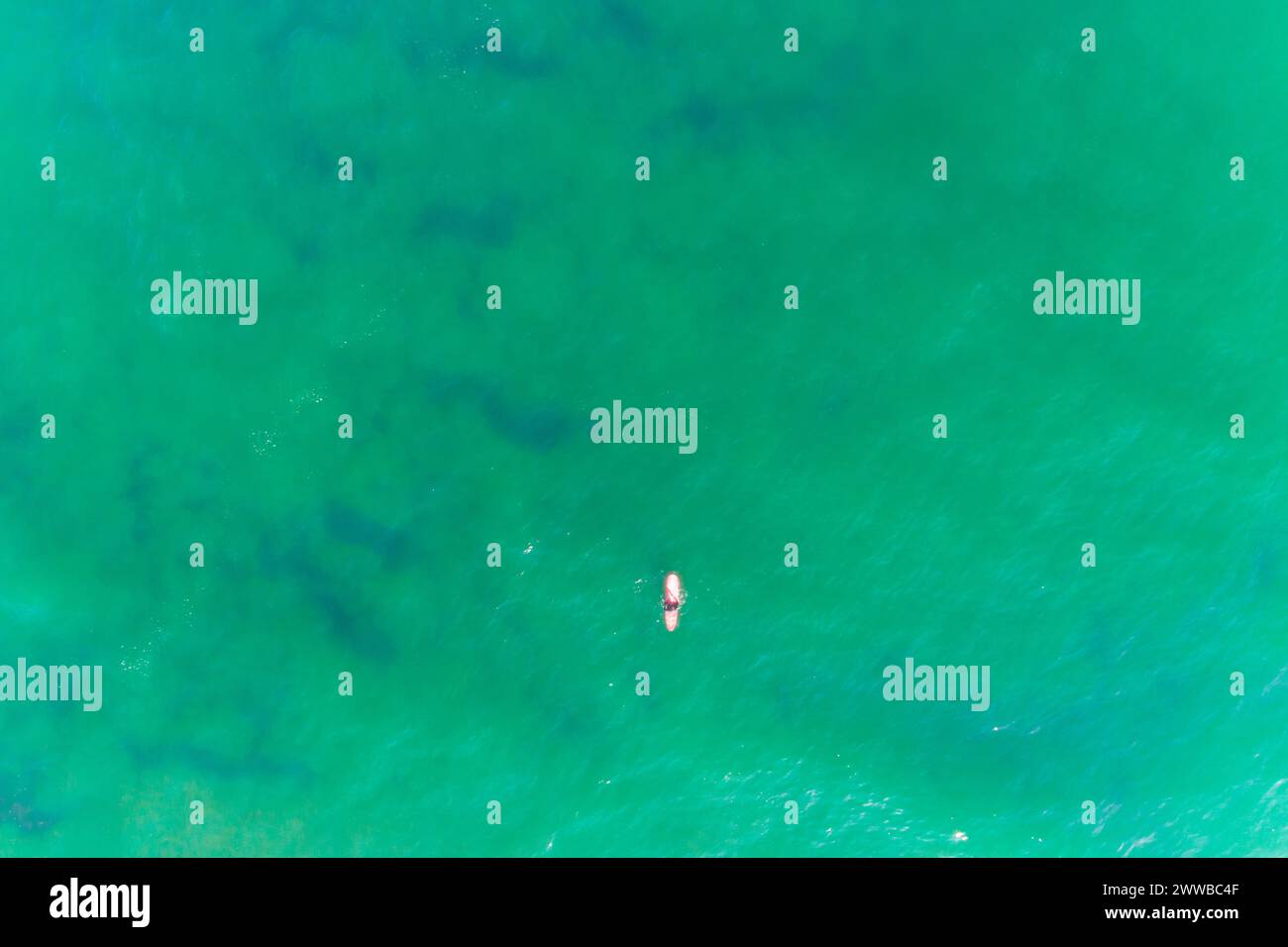 Aerial view following man surfing hi-res stock photography and images ...