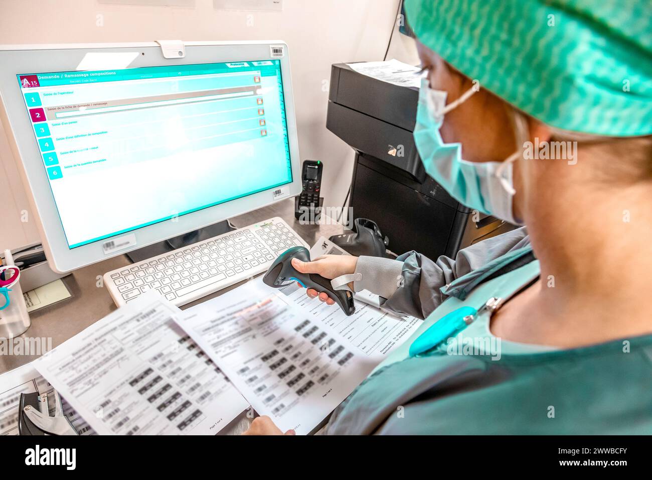 Technician checking the material entering the washing room before ...
