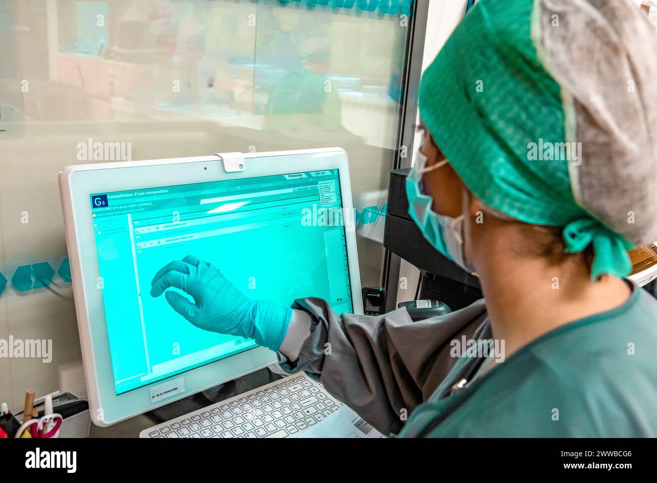 Technician checking the material entering the washing room before ...
