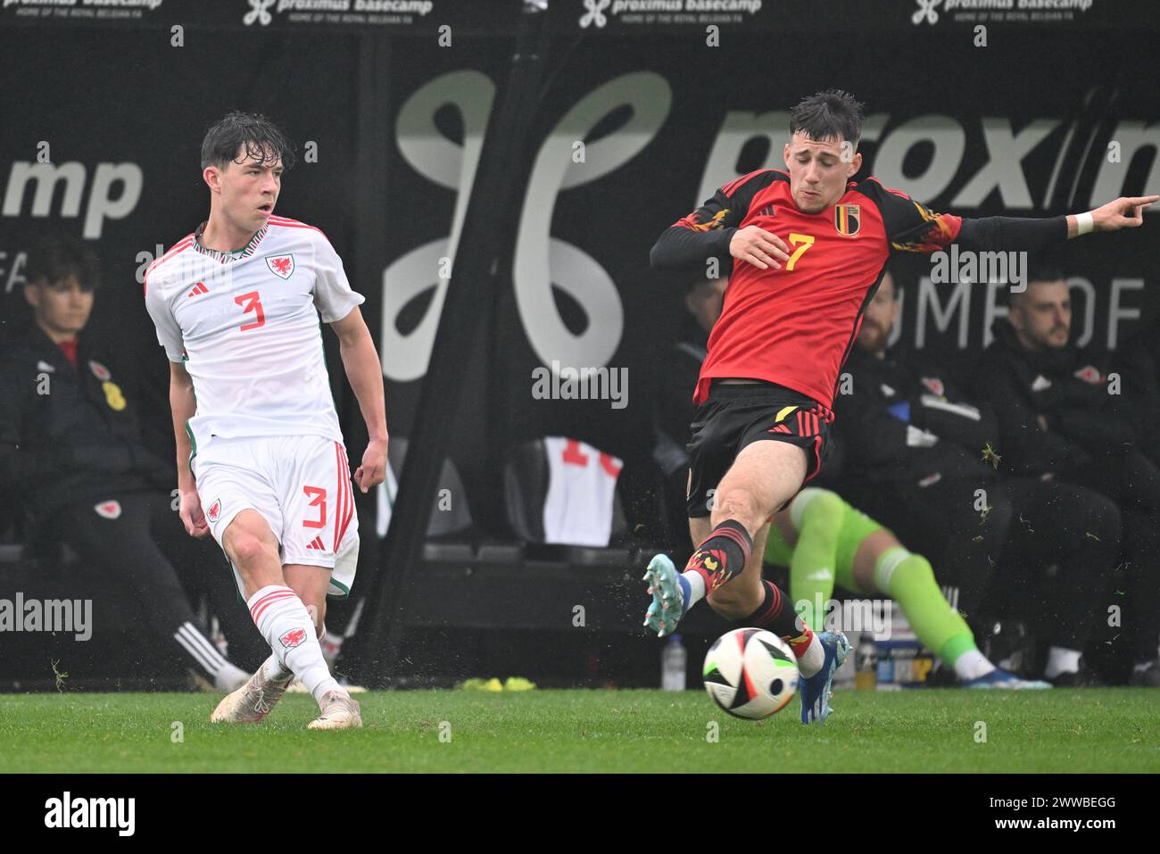 Tubize, Belgium. 22nd Mar, 2024. Luey Giles (3) of Wales and Cedric ...