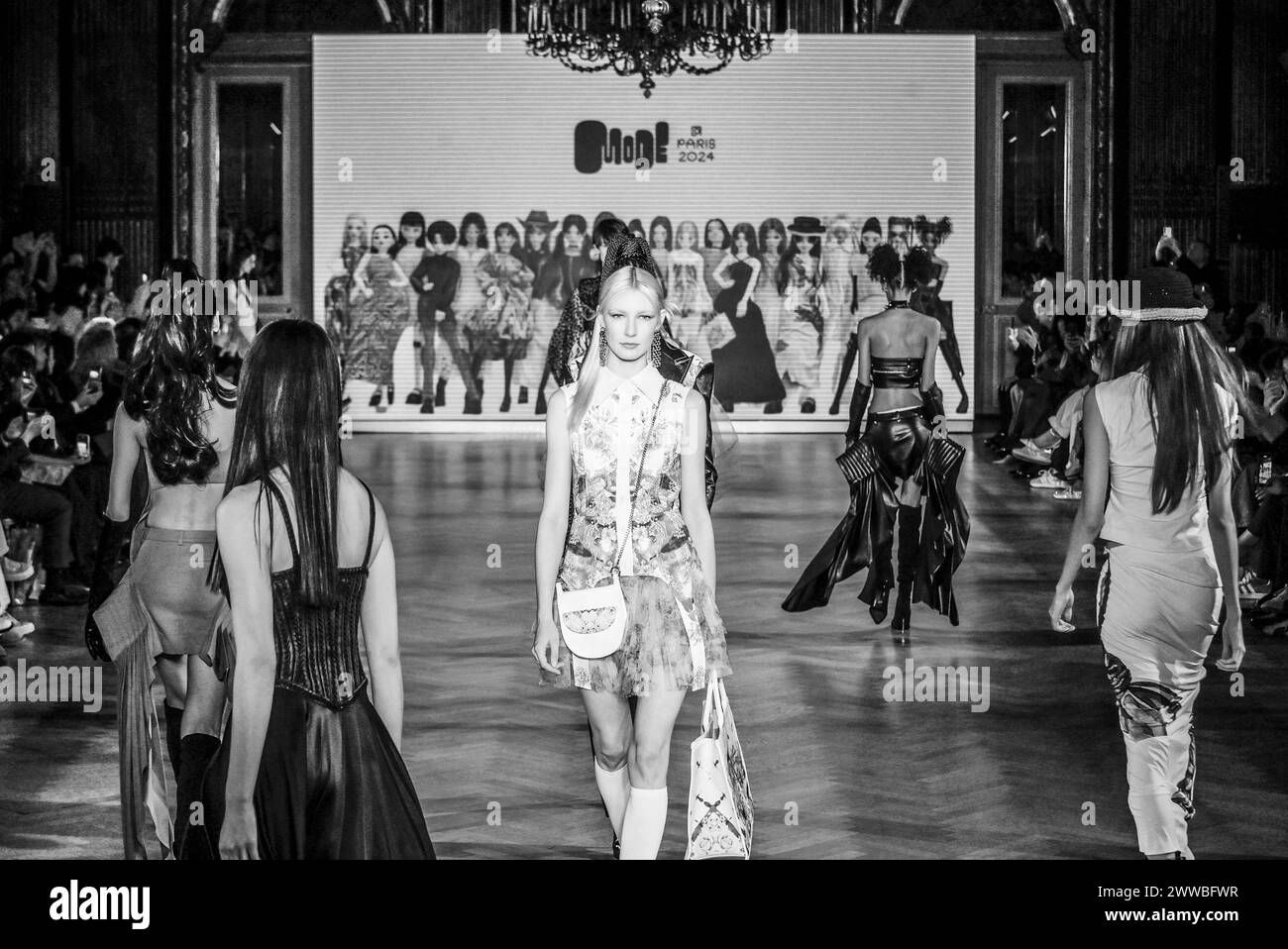 Paris, France. 22nd Mar, 2024. Models walk the runway during the "Mode ...