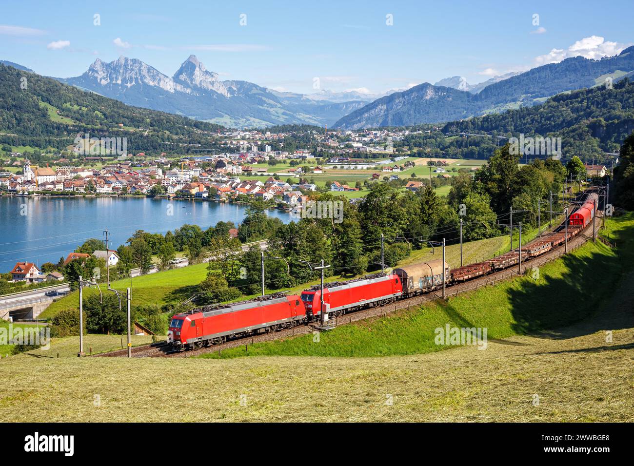 Freight goods train of DB Cargo at Grosser Mythen mountain at Lake Zug ...