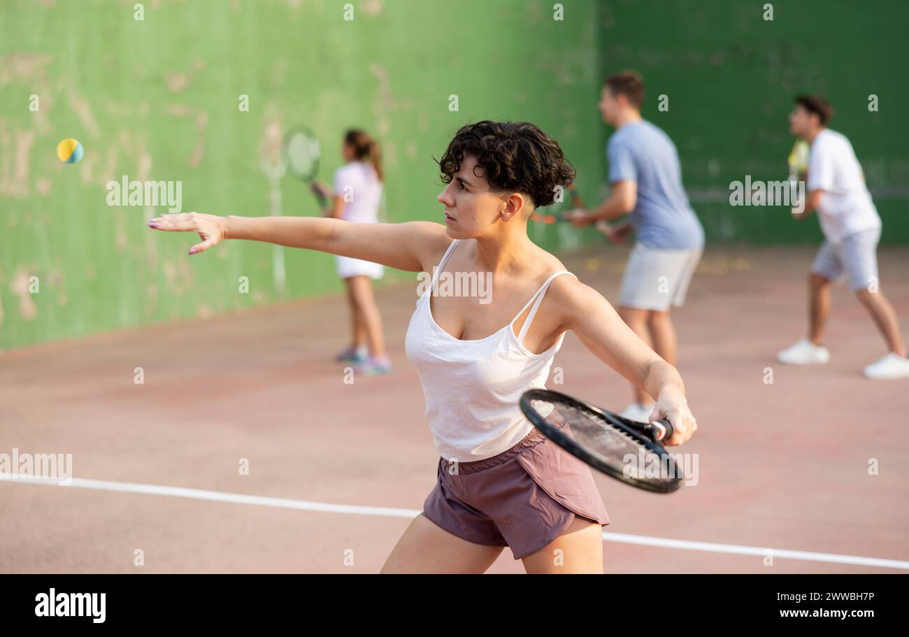 Woman playing frontenis on outdoor pelota court Stock Photo - Alamy
