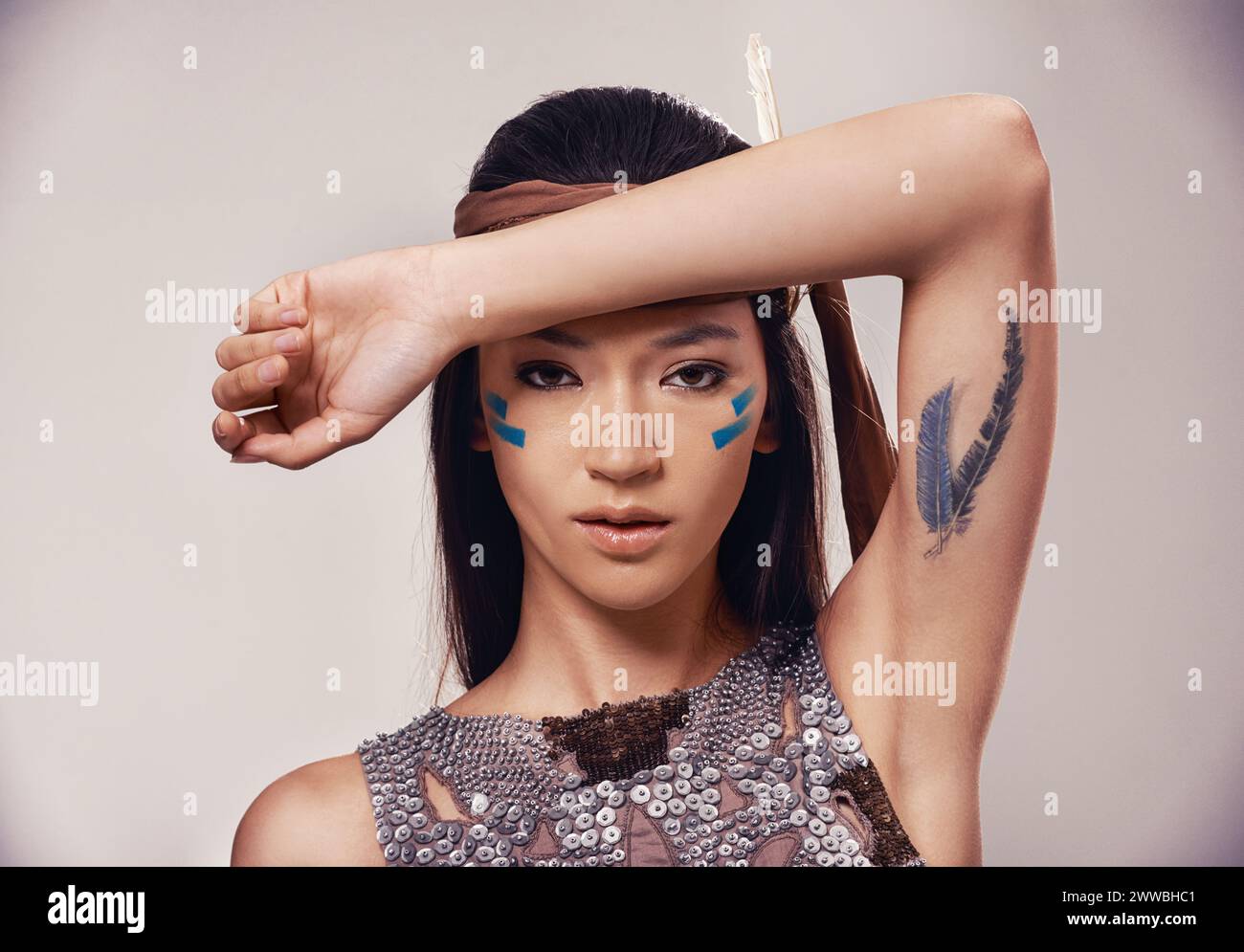 Portrait, woman and Native American girl in studio with warrior makeup ...