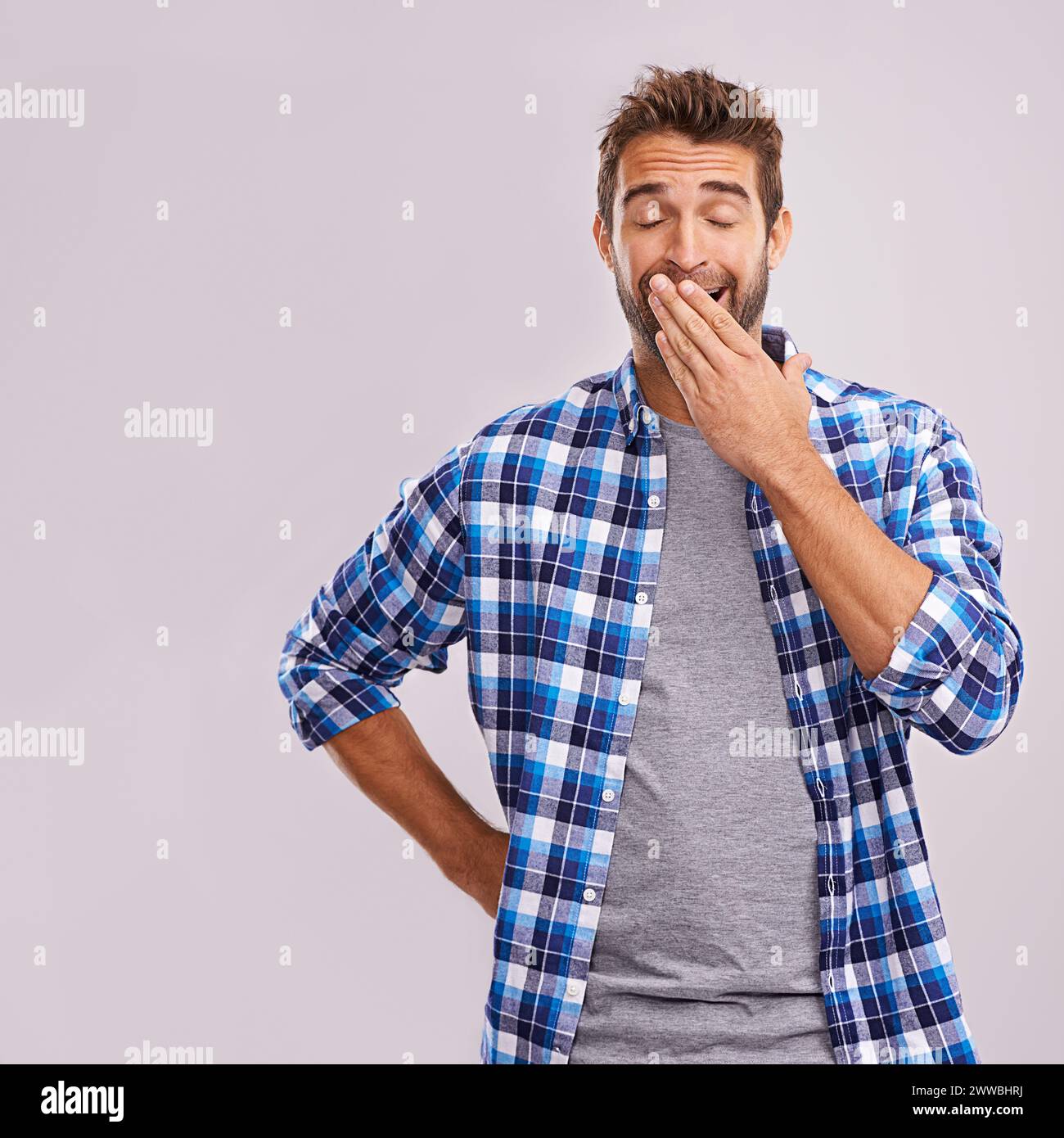 Hand cover mouth, yawn and man with burnout, tired and low energy on a ...