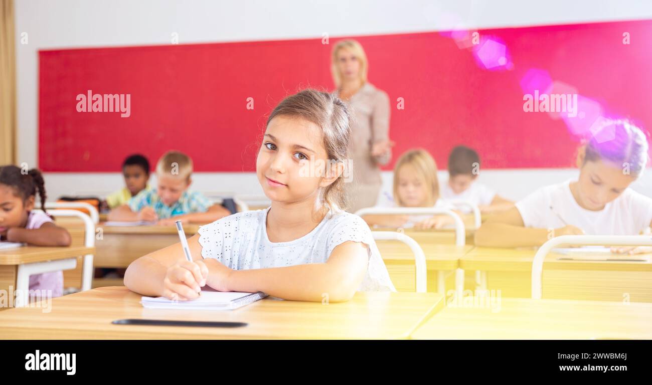 School girl working at lesson in classroom Stock Photo - Alamy