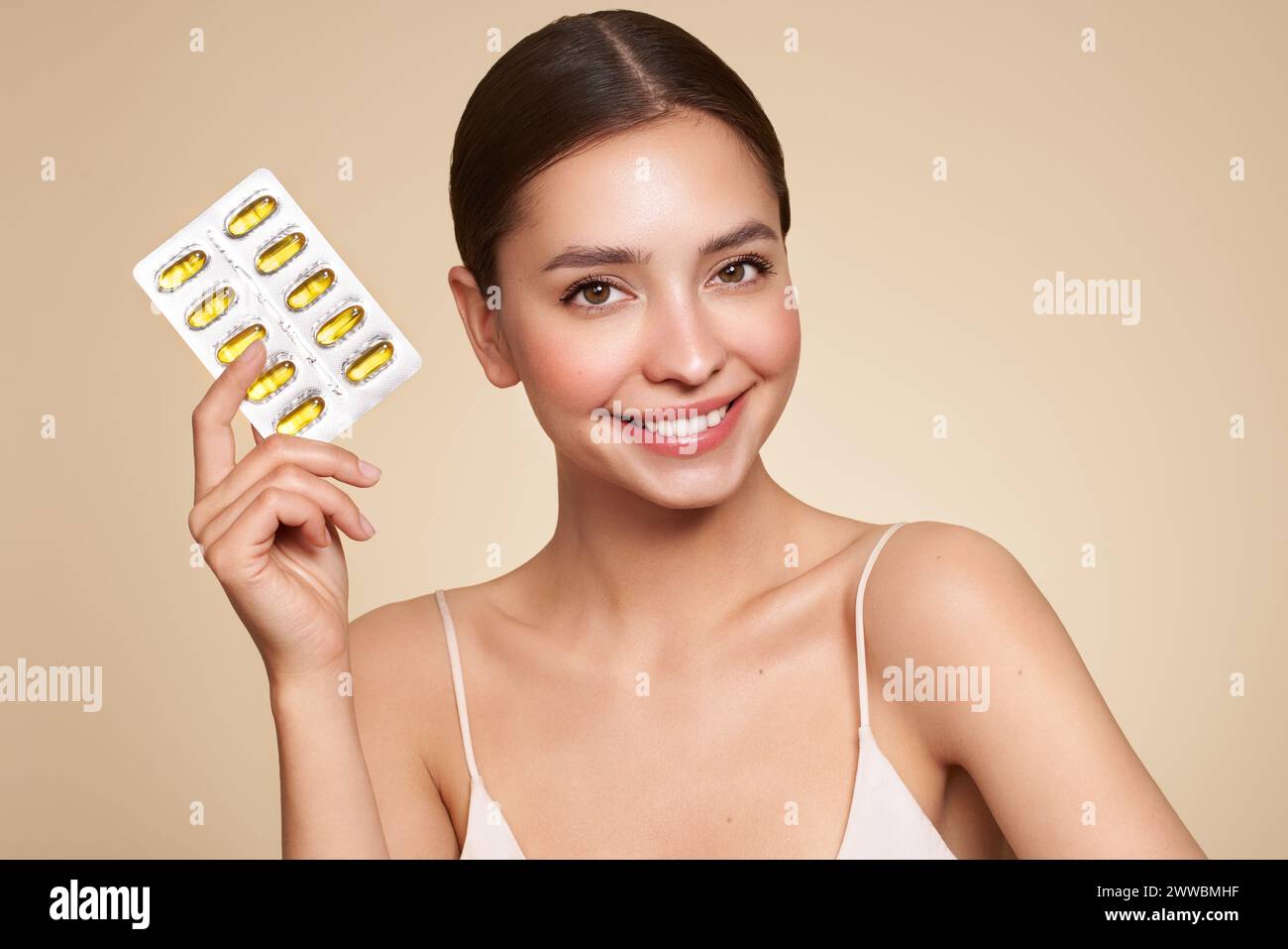 Vitamins. Close Up Of Happy Beautiful Girl With Pill With Cod Liver Oil ...