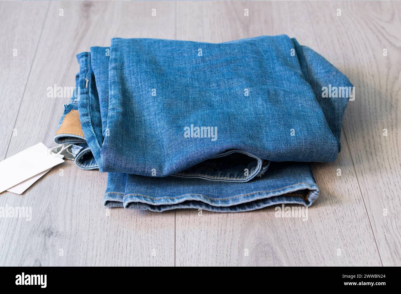 New denim trousers on the shelf, mockup, without name. close-up Stock ...