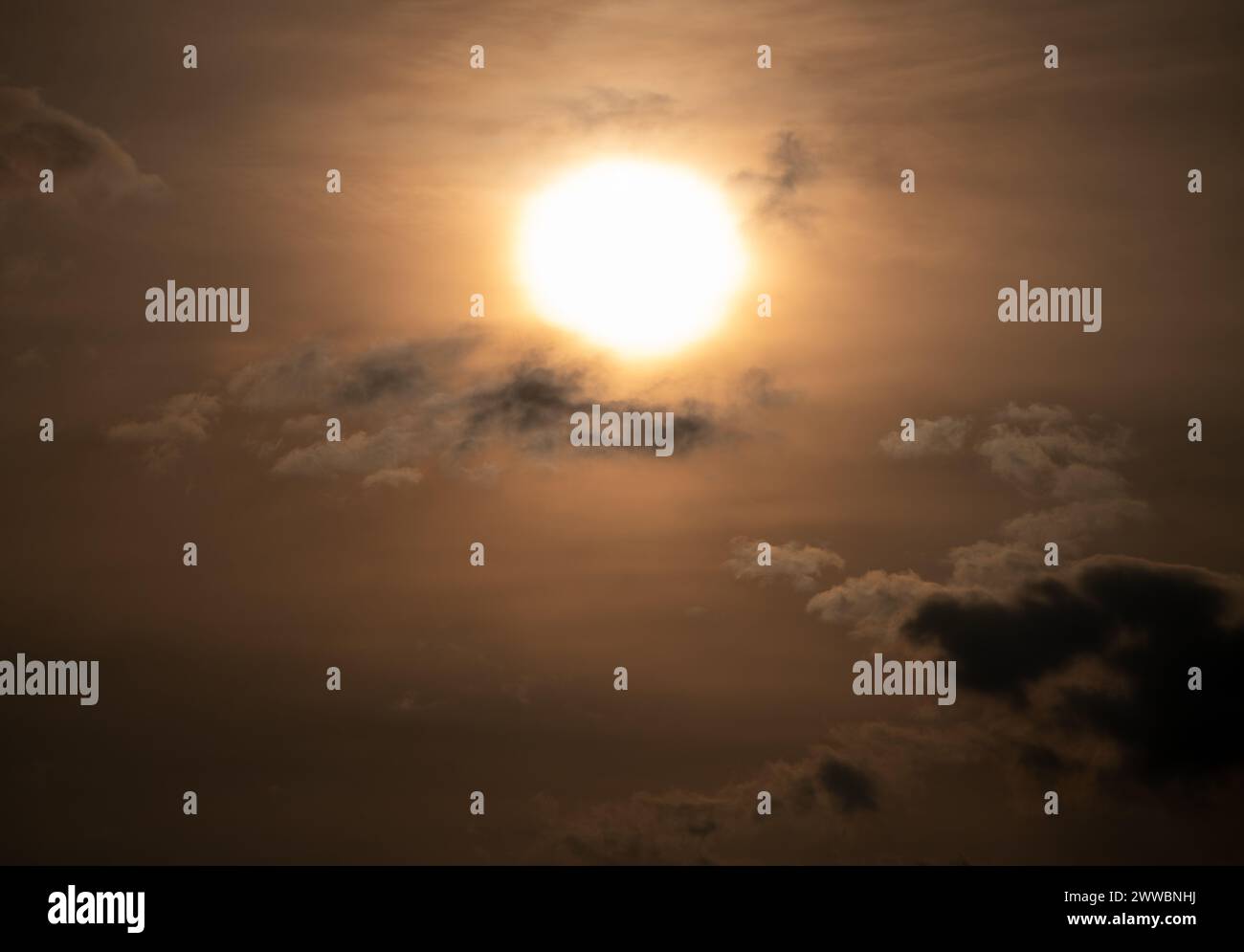 Sun behind thin layer hi-res stock photography and images - Alamy