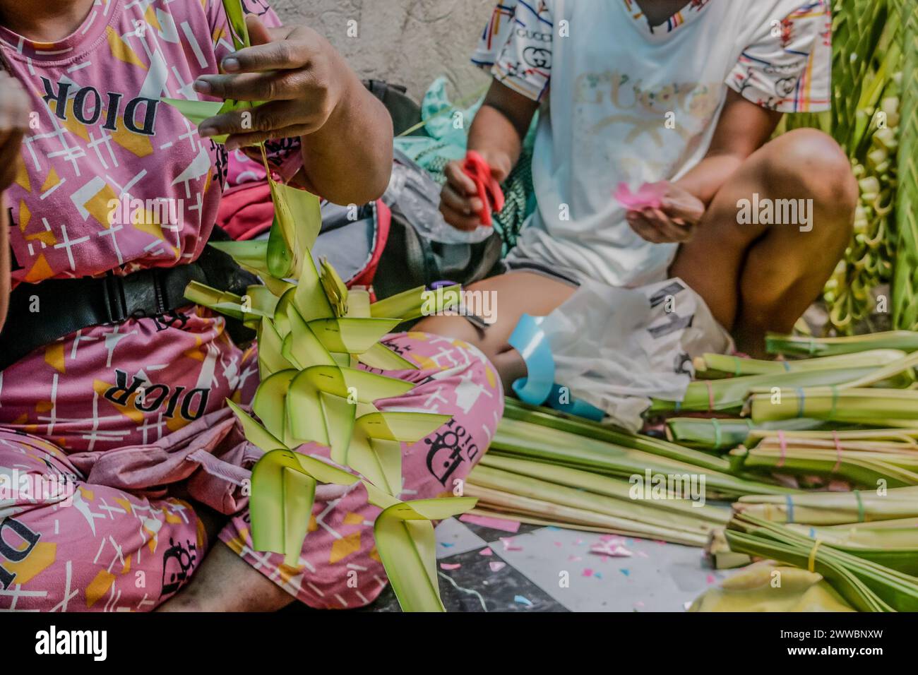 Antipolo City, Philippines. 23rd Mar, 2024. People make palm fronds in ...