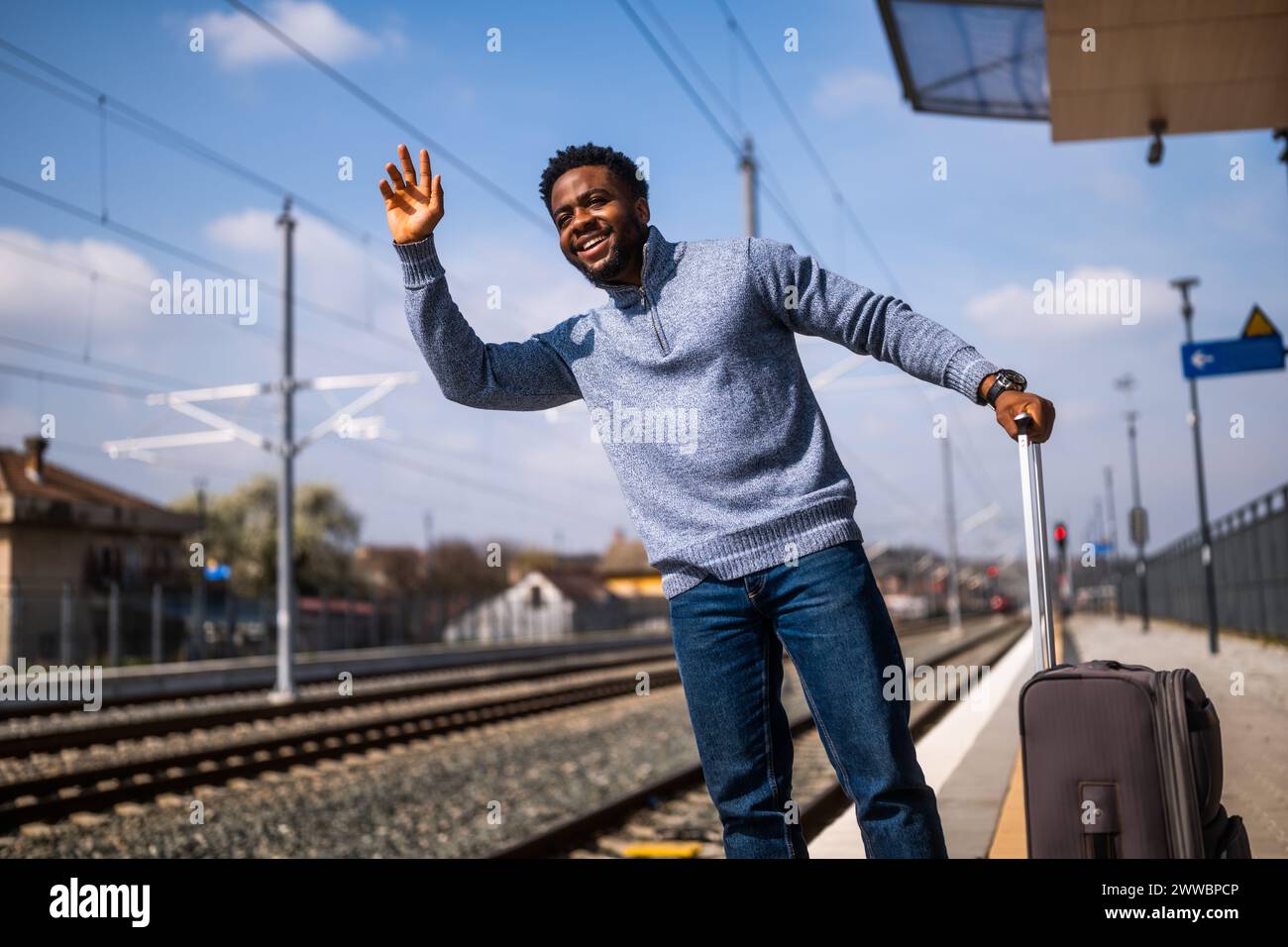 Standing transportation waving leaving hi-res stock photography and ...
