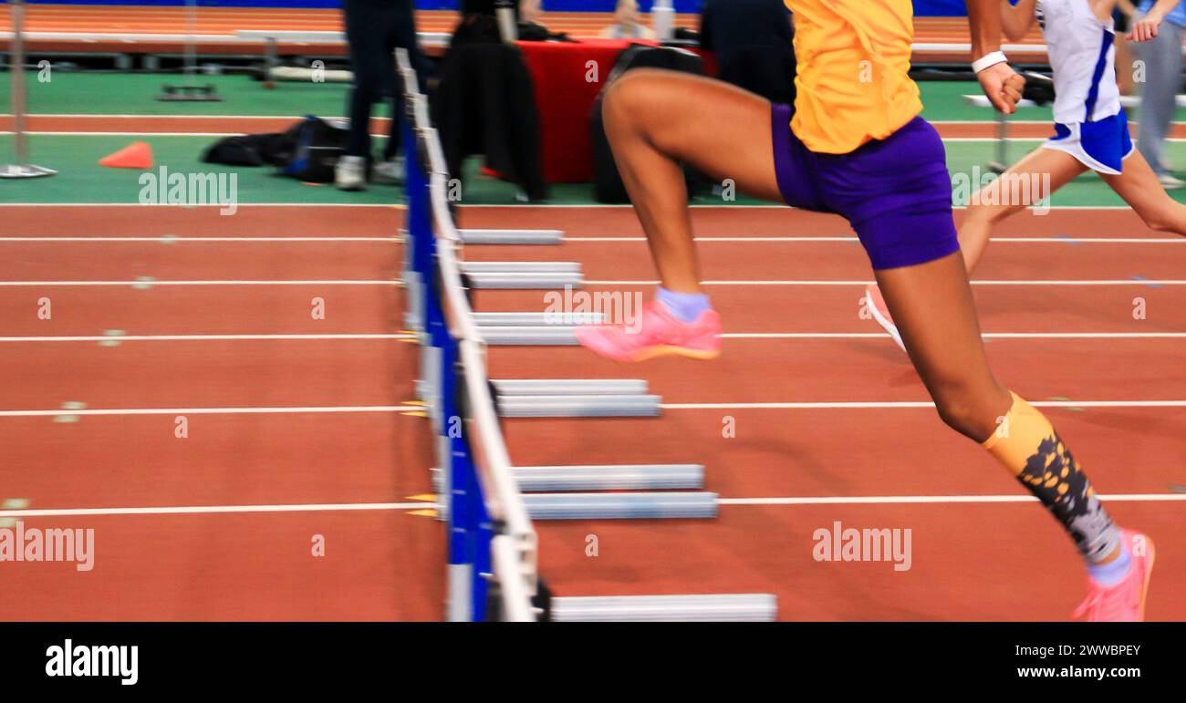Blurred view of athlete jumping hurdles hi-res stock photography and ...