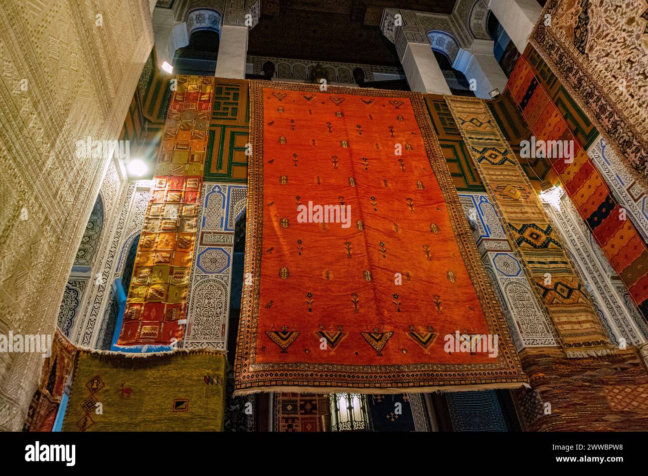 Rugs hanging from every available space deep in the Fes Medina in ...