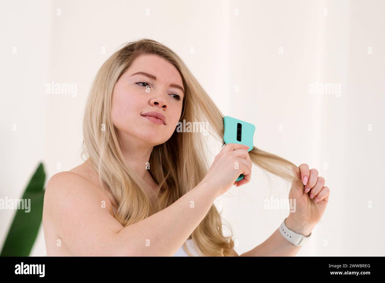 Hair Brushing As Part Of Morning Routine Young Blonde Woman Carefully