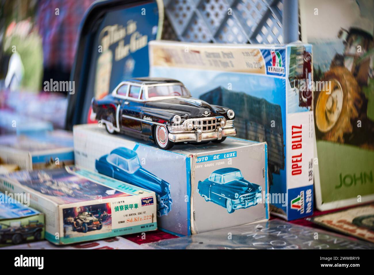 LINTHE, GERMANY - MAY 27, 2023: Cadillac toy car. Flea market at the exhibition. Art lens. Swirl ...