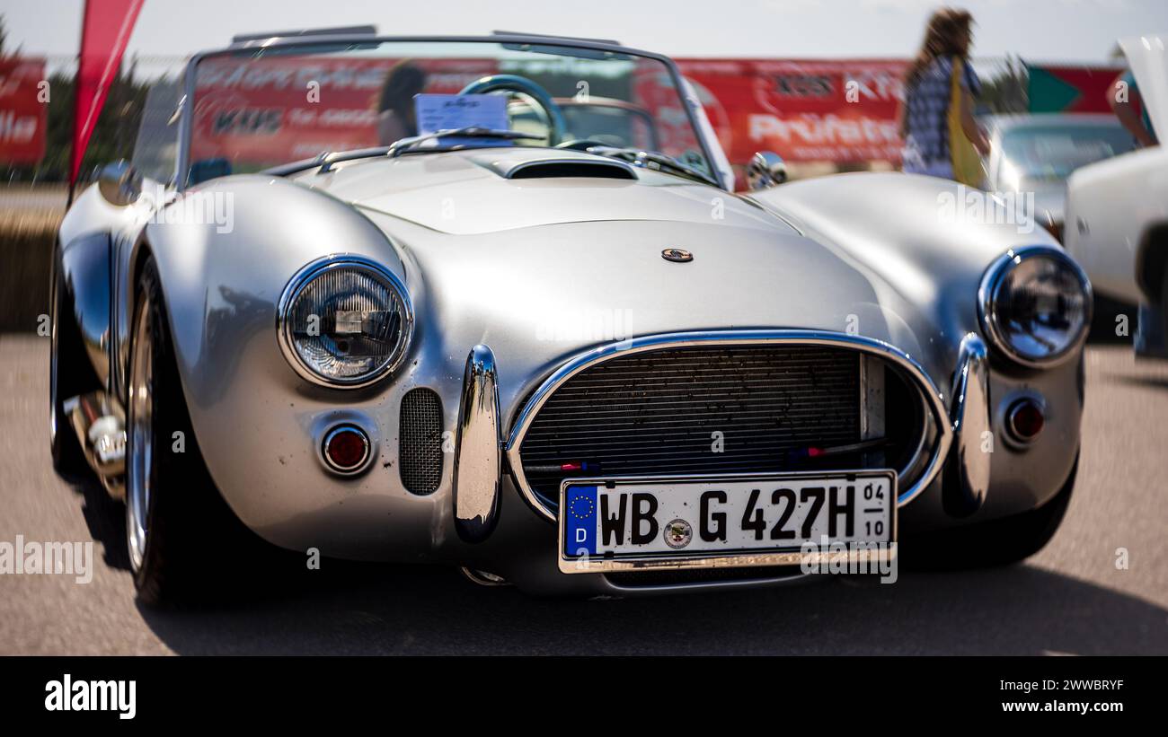 LINTHE, GERMANY - MAY 27, 2023: The sports car AC Cobra 427, 1974. Art lens. Swirl bokeh. Die ...