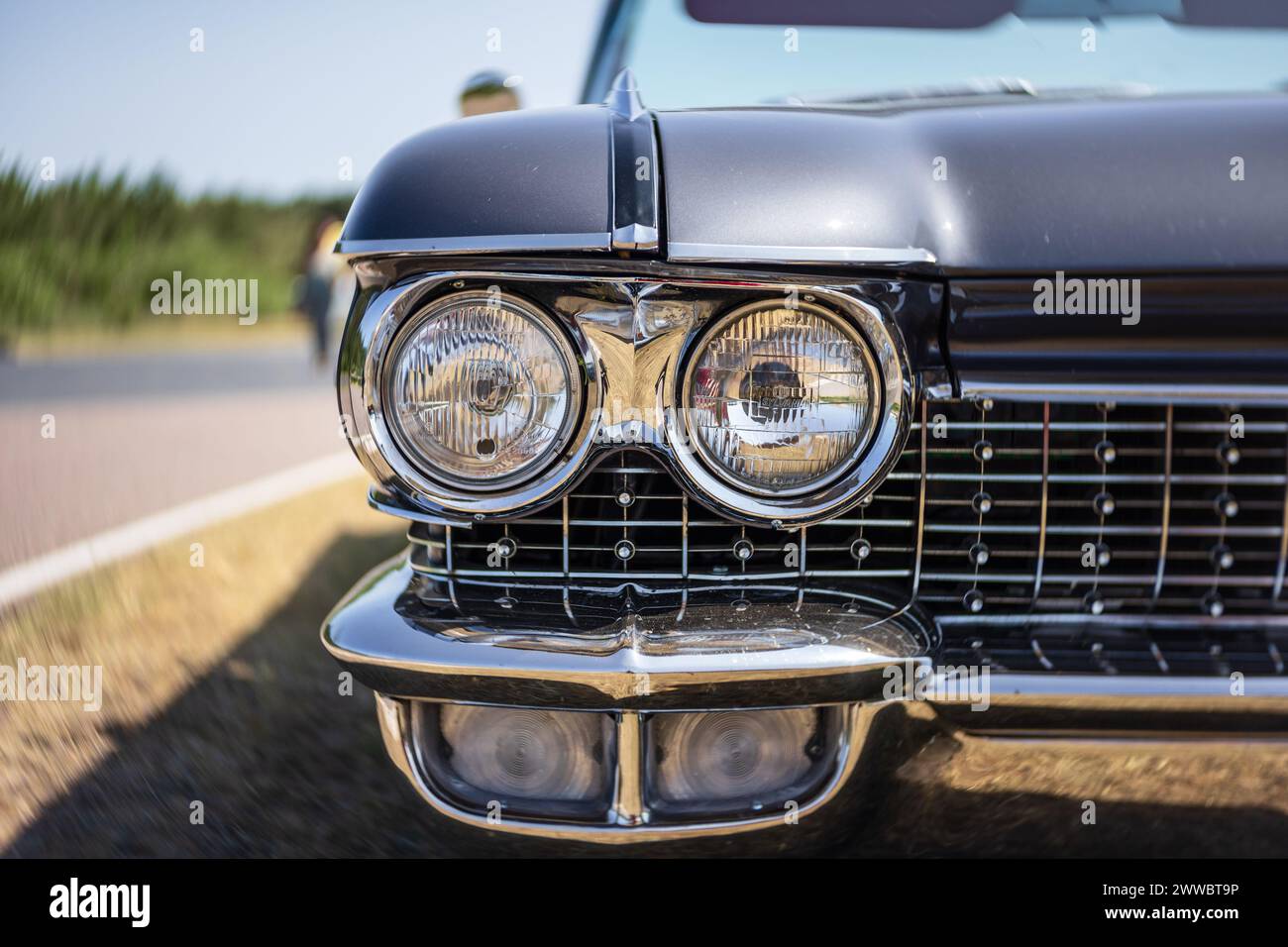 LINTHE, GERMANY - MAY 27, 2023: The headlights of a full-size luxury car Cadillac Series 62 ...