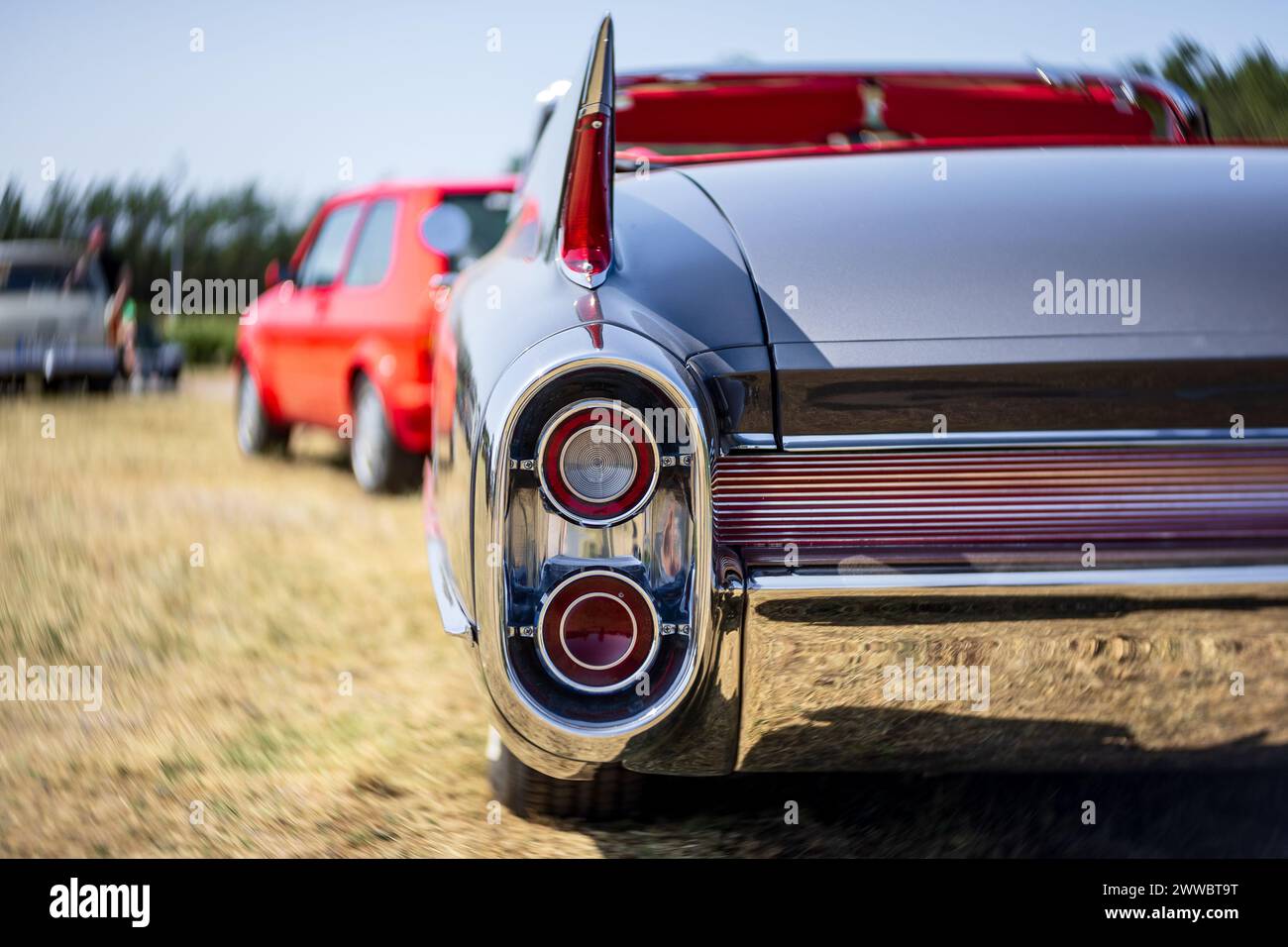 LINTHE, GERMANY - MAY 27, 2023: The stoplights of a full-size luxury car Cadillac Series 62 ...