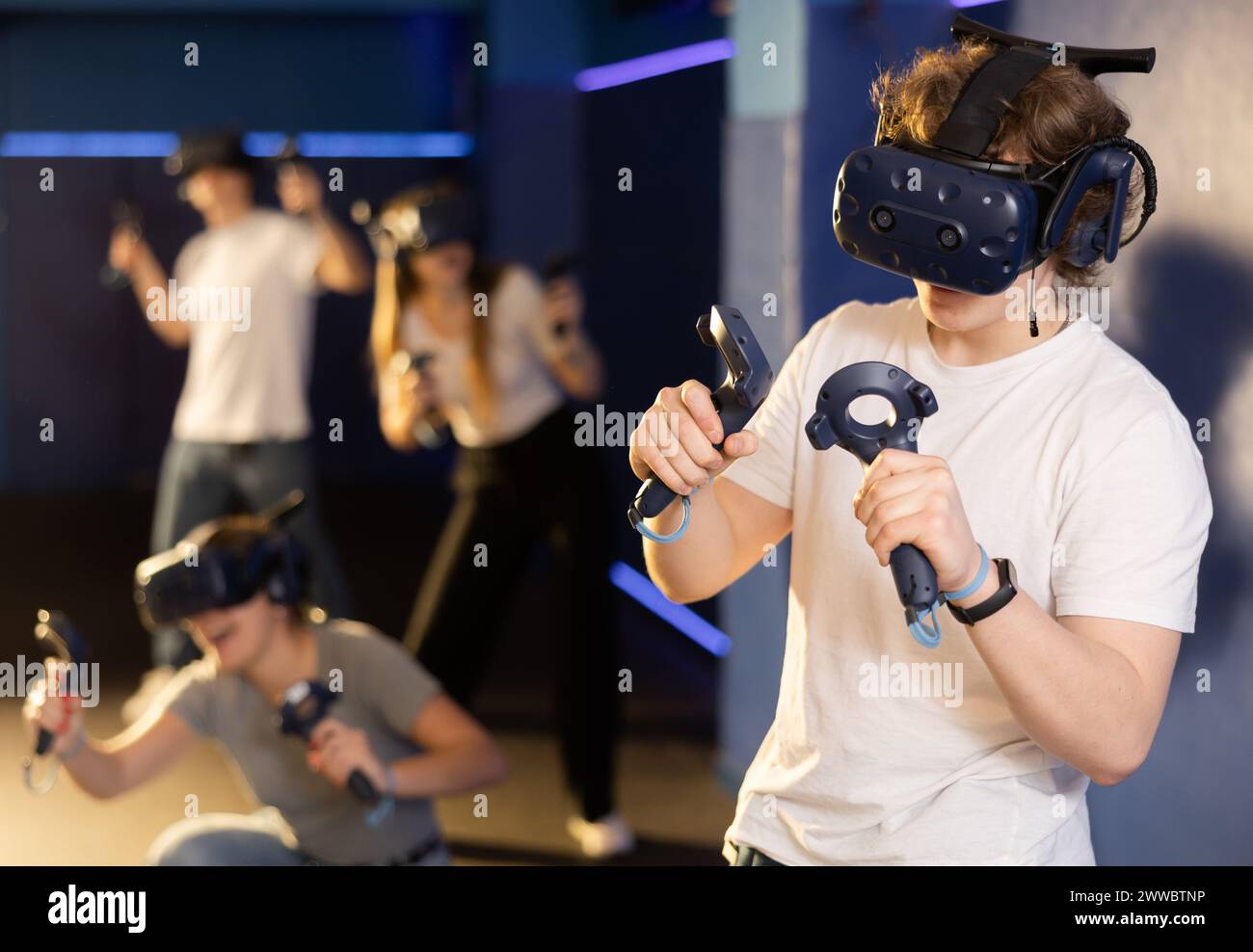 Emotional teenager in VR headset immersed in virtual reality game Stock ...