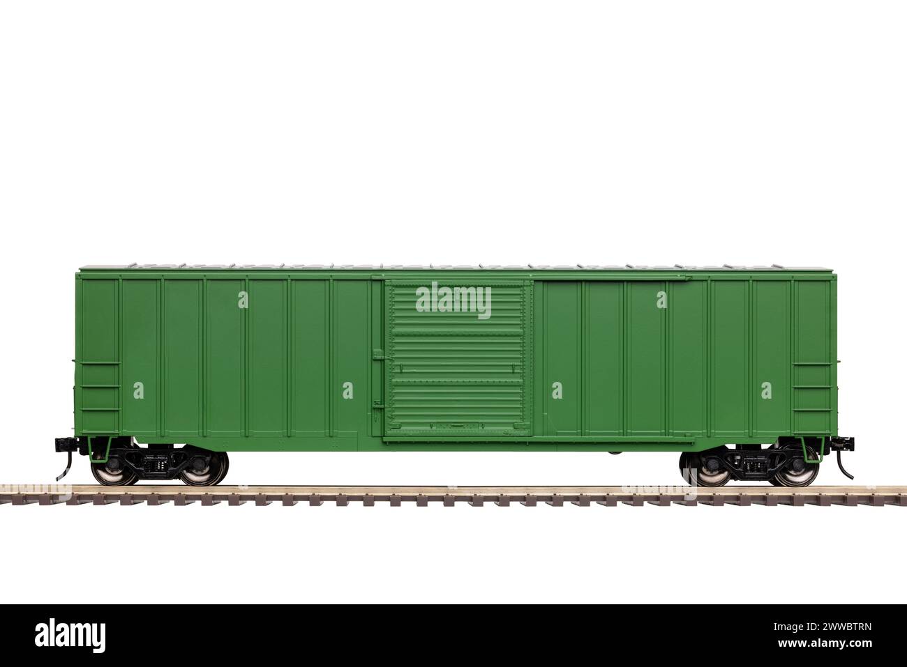 A green railroad box car with closed door on railroad track Stock Photo ...