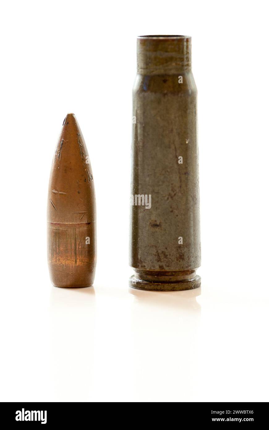 gun cartridge with bullet and case on white background with reflexion ...