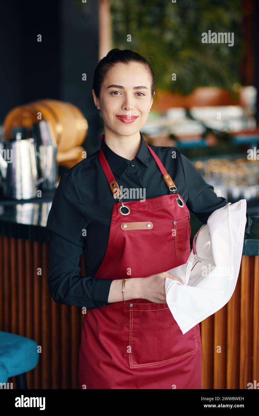 Cheerful bartender wiping glass hi-res stock photography and images - Alamy