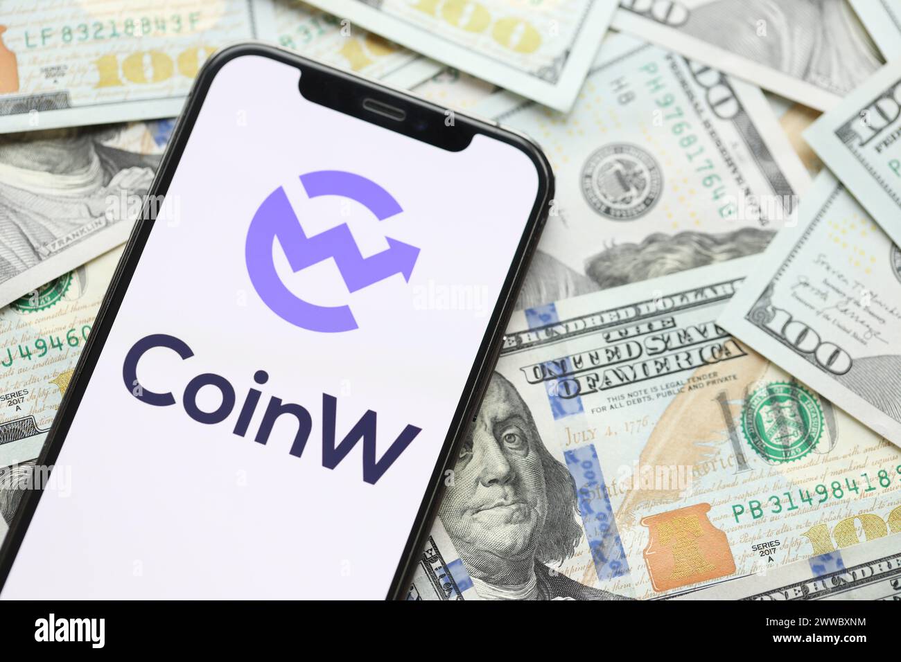 KYIV, UKRAINE - MARCH 15, 2024 CoinW logo on iPhone display screen with ...