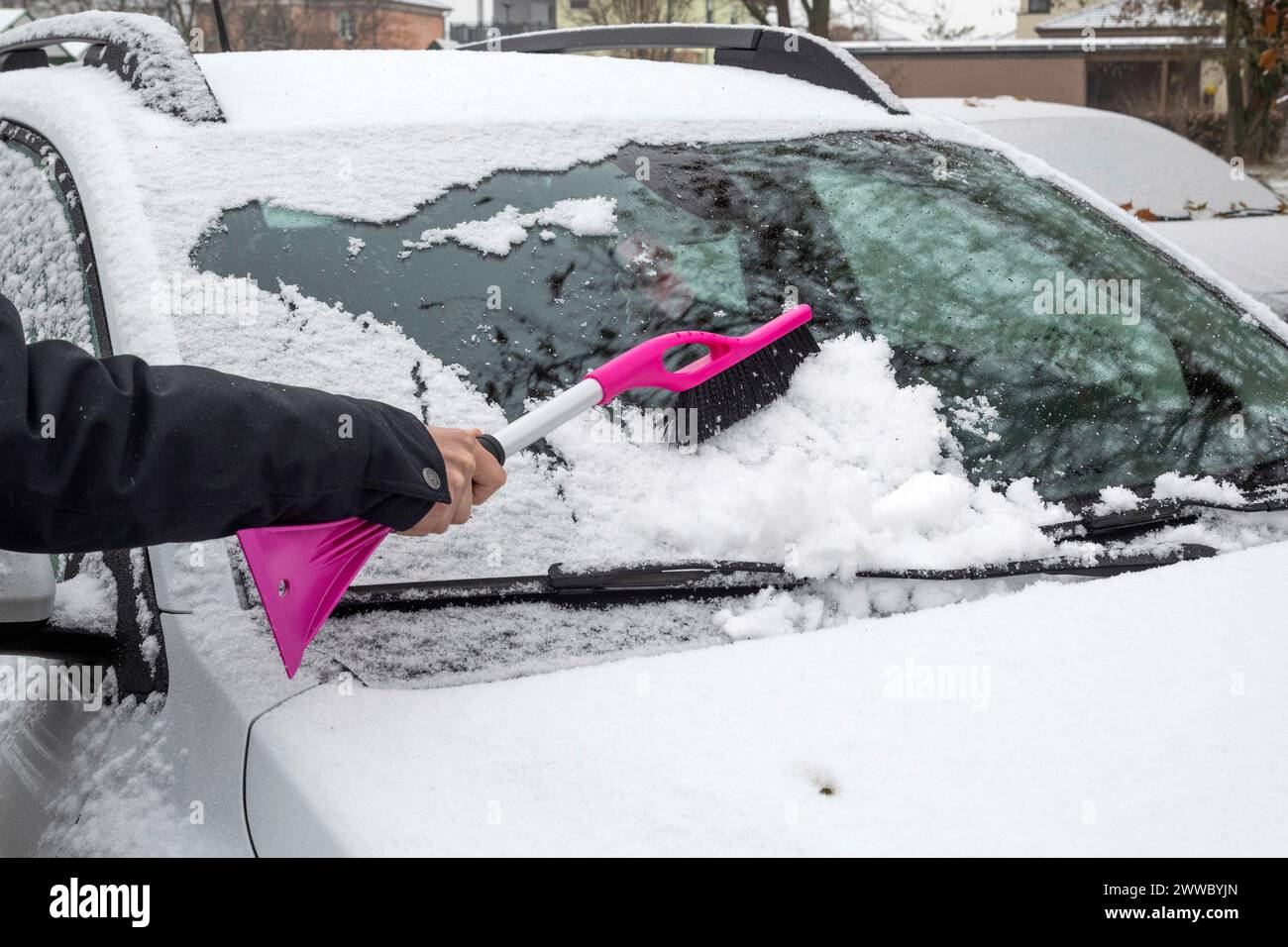 Car, Cleaning Snow From The Windshield In Winter Stock Photo - Alamy