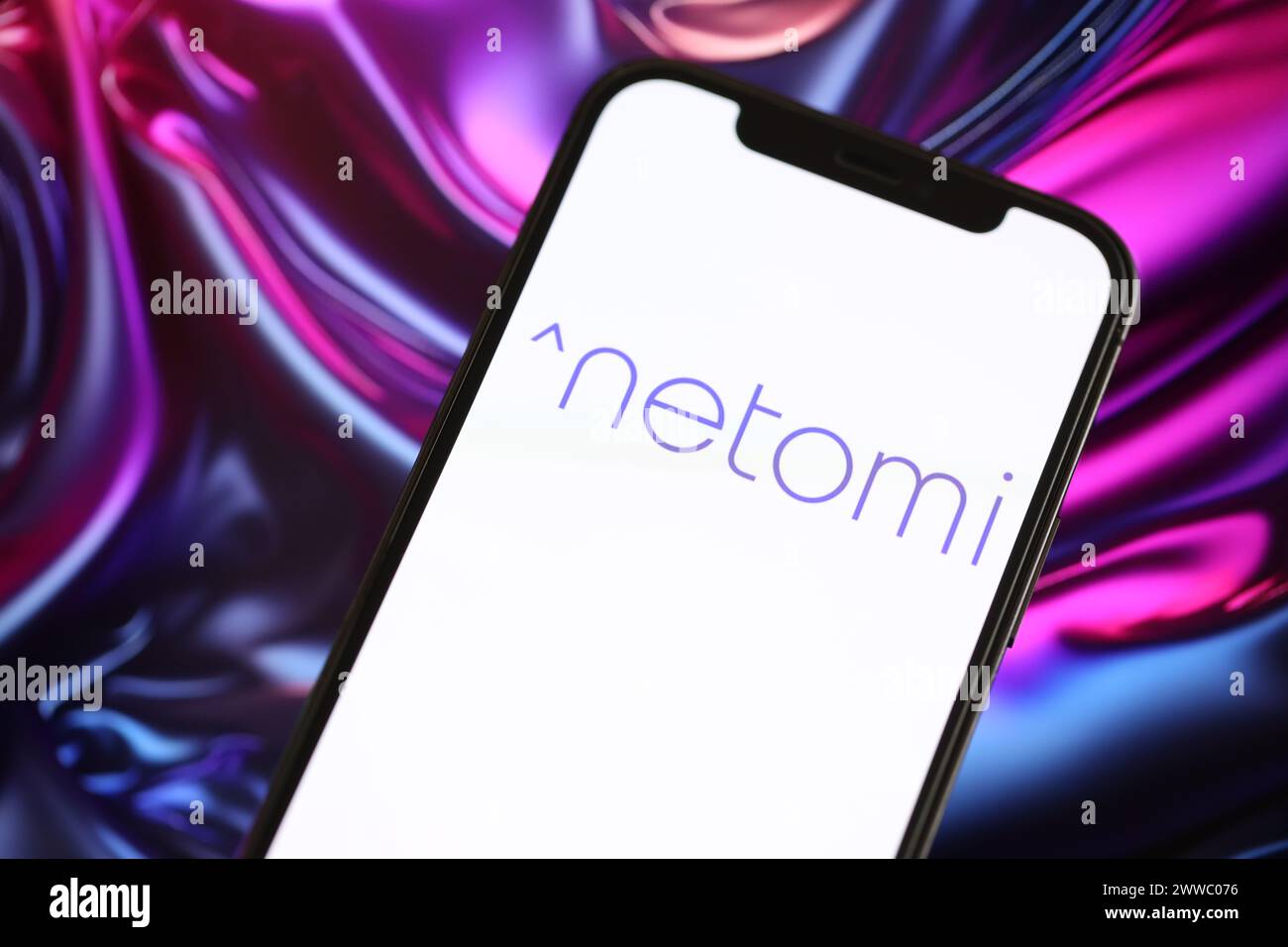 KYIV, UKRAINE - MARCH 17, 2024 Netomi logo on iPhone display screen ...
